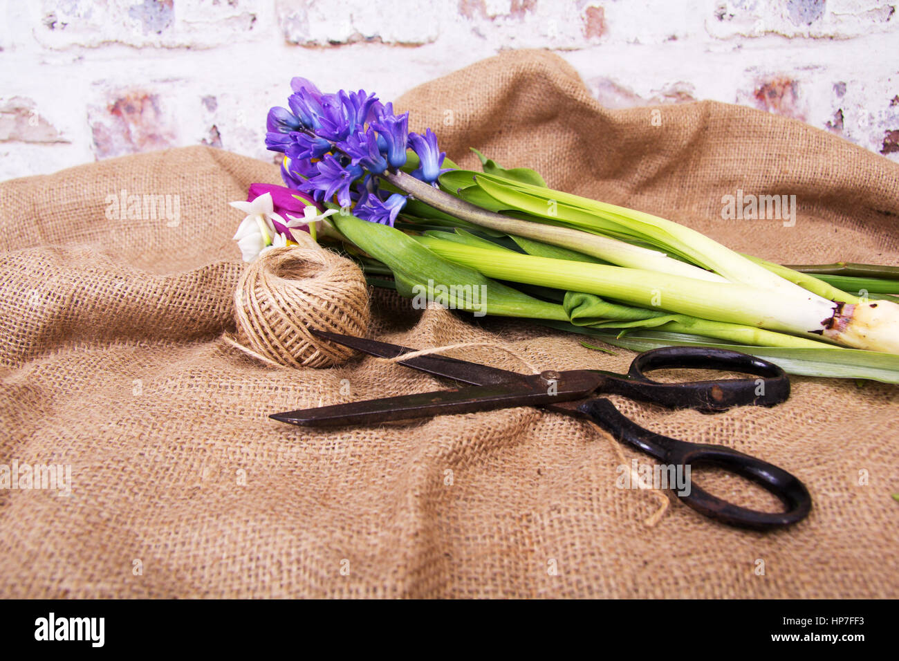 Spring cut flower arrangement against a rustic background Stock Photo ...