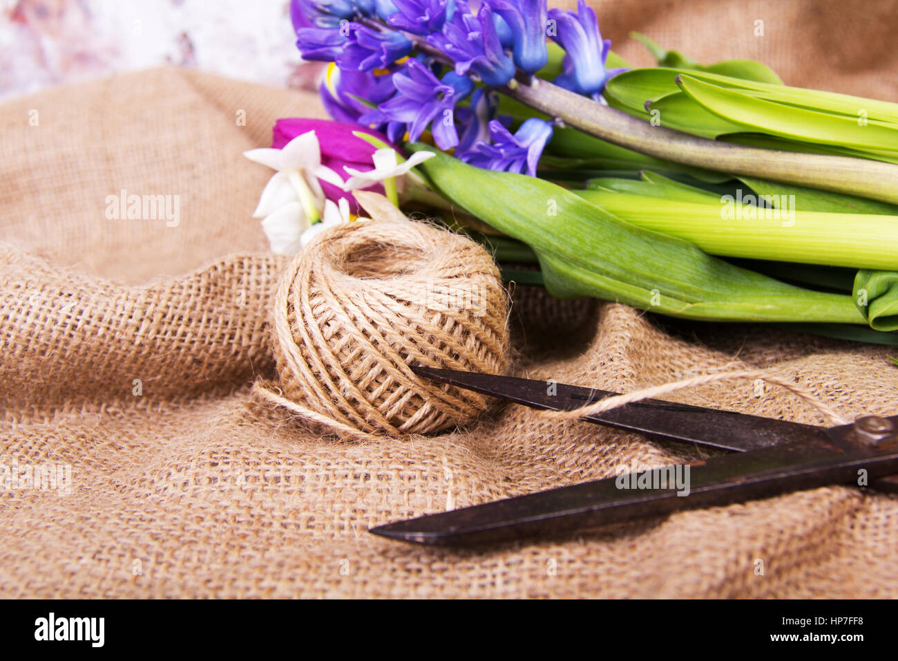 Spring cut flower arrangement against a rustic background Stock Photo ...