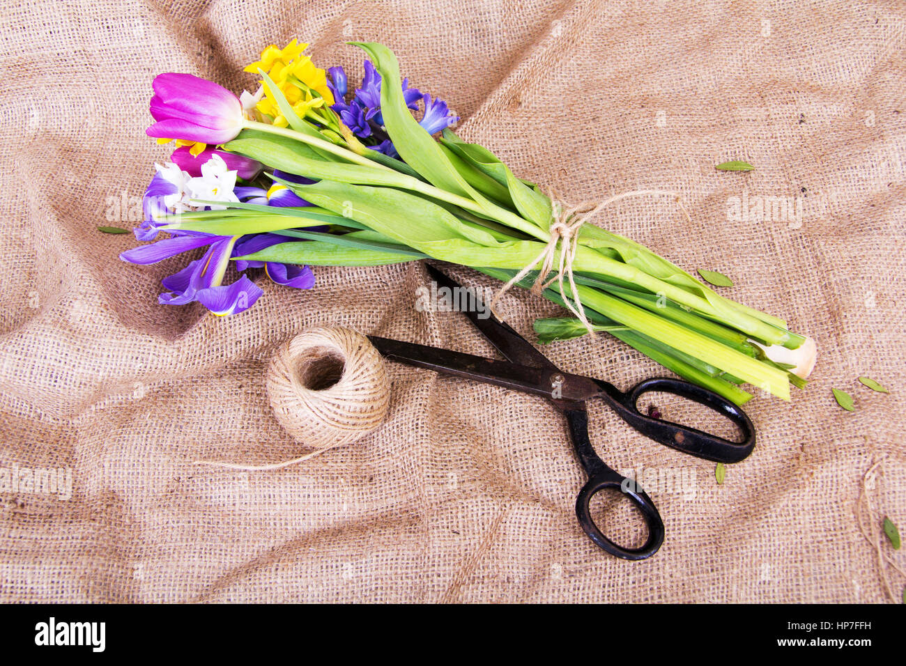 Spring cut flower arrangement against a rustic background Stock Photo ...