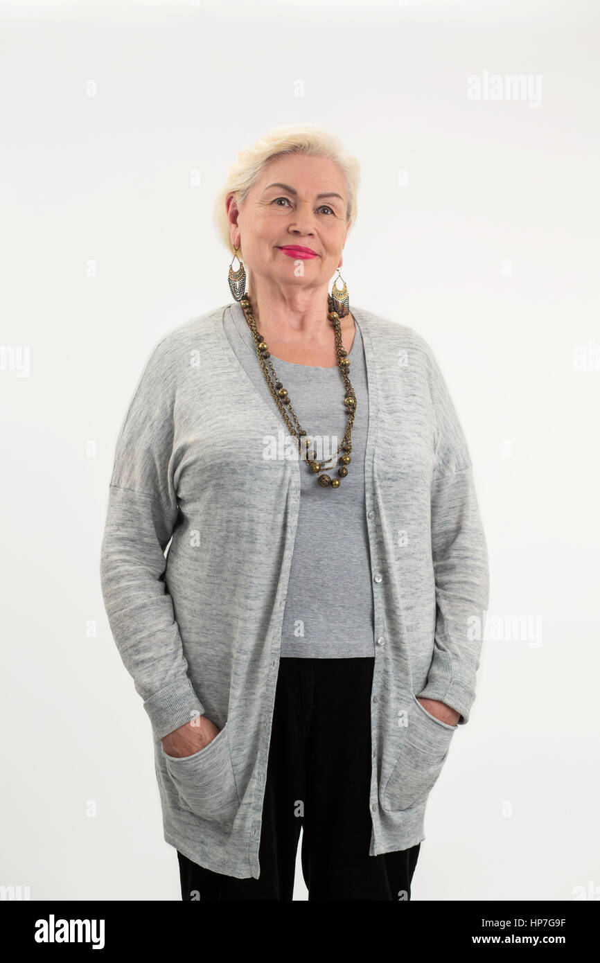 Elderly woman standing isolated. Senior lady on white background. How ...