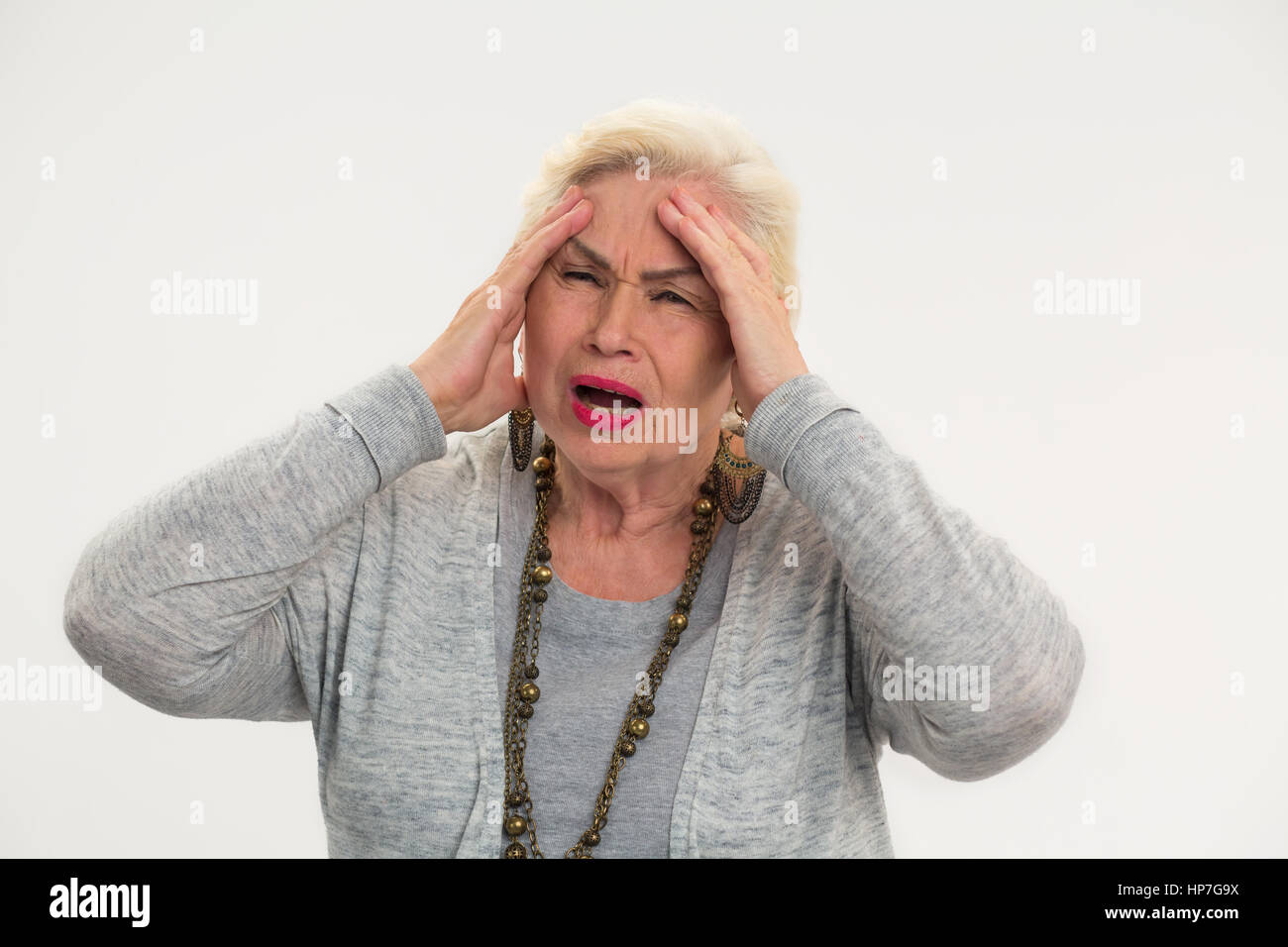 Senior woman having a headache. Lady holding her head isolated Stock ...