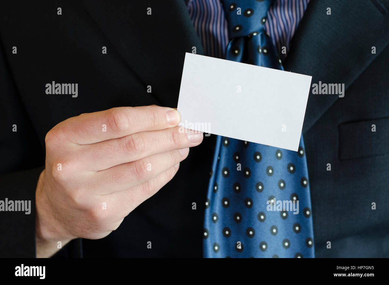 Human hand and text note over businessman background Stock Photo - Alamy