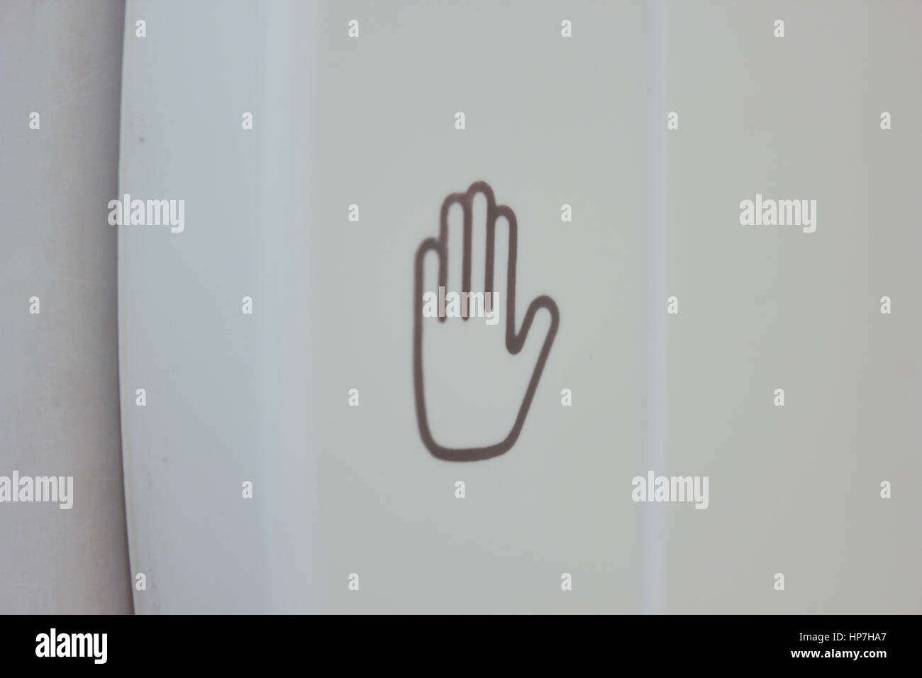 Symbol for opening door in shape of hand Stock Photo - Alamy