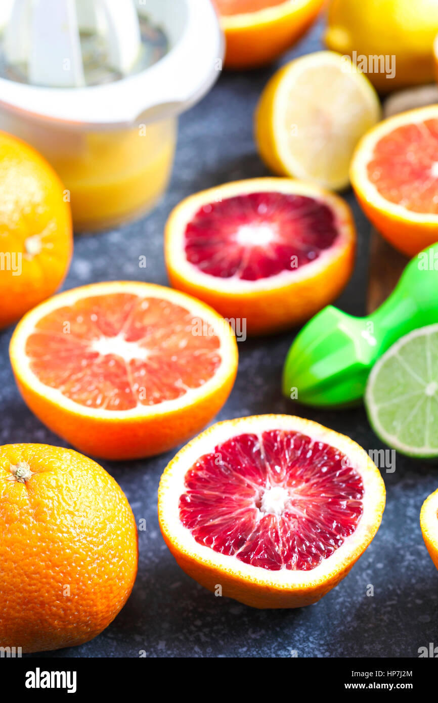 Citrus fruits on stone background Stock Photo - Alamy