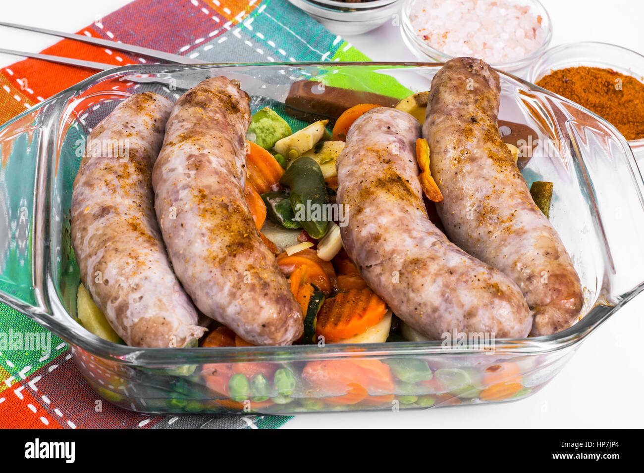 Country sausage with vegetables baked in the shape of glass. Studio ...