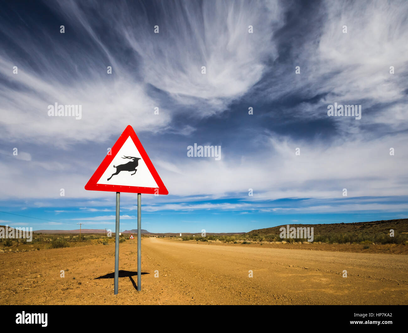 Exotic traffic sign in front of blue cloudy sky, Namibia Stock Photo ...