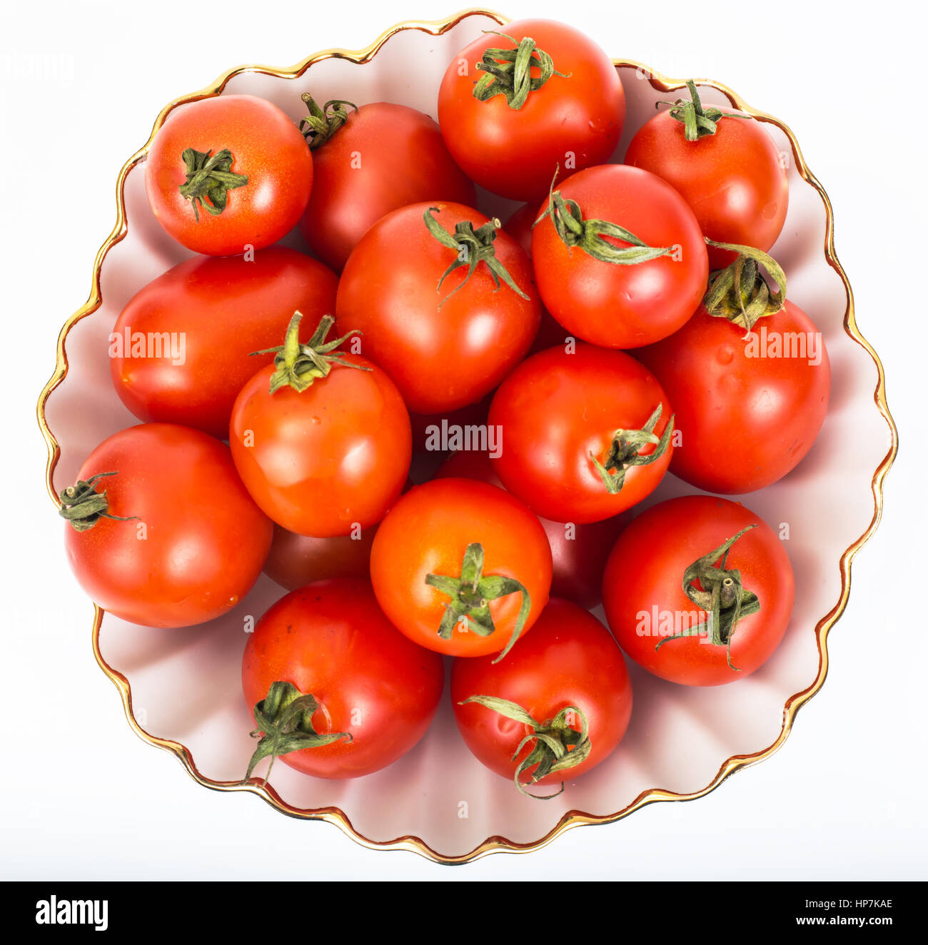 Fresh small tomatoes in white salad bowl. Studio Photo Stock Photo - Alamy