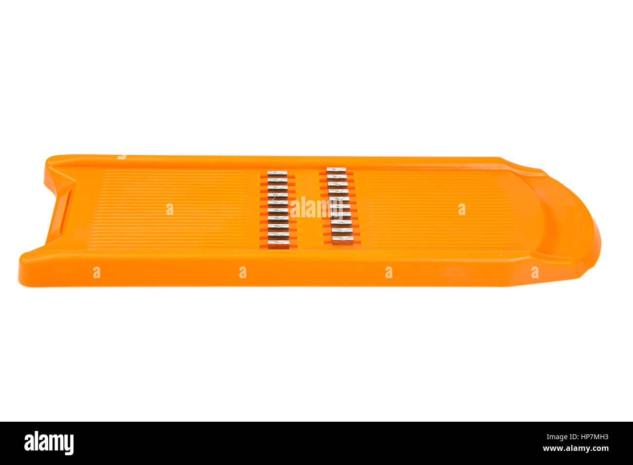 Grater for vegetables on white. Studio Photo Stock Photo - Alamy