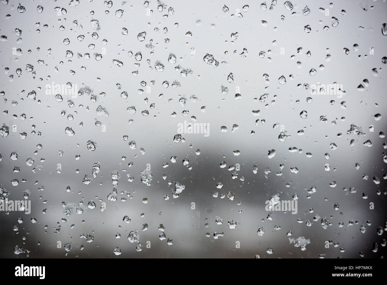 frozen raindrops on glass with blur background and gradient Stock Photo ...