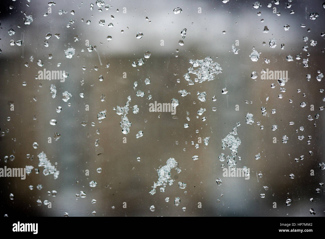 frozen raindrops on glass with blur background and gradient Stock Photo ...