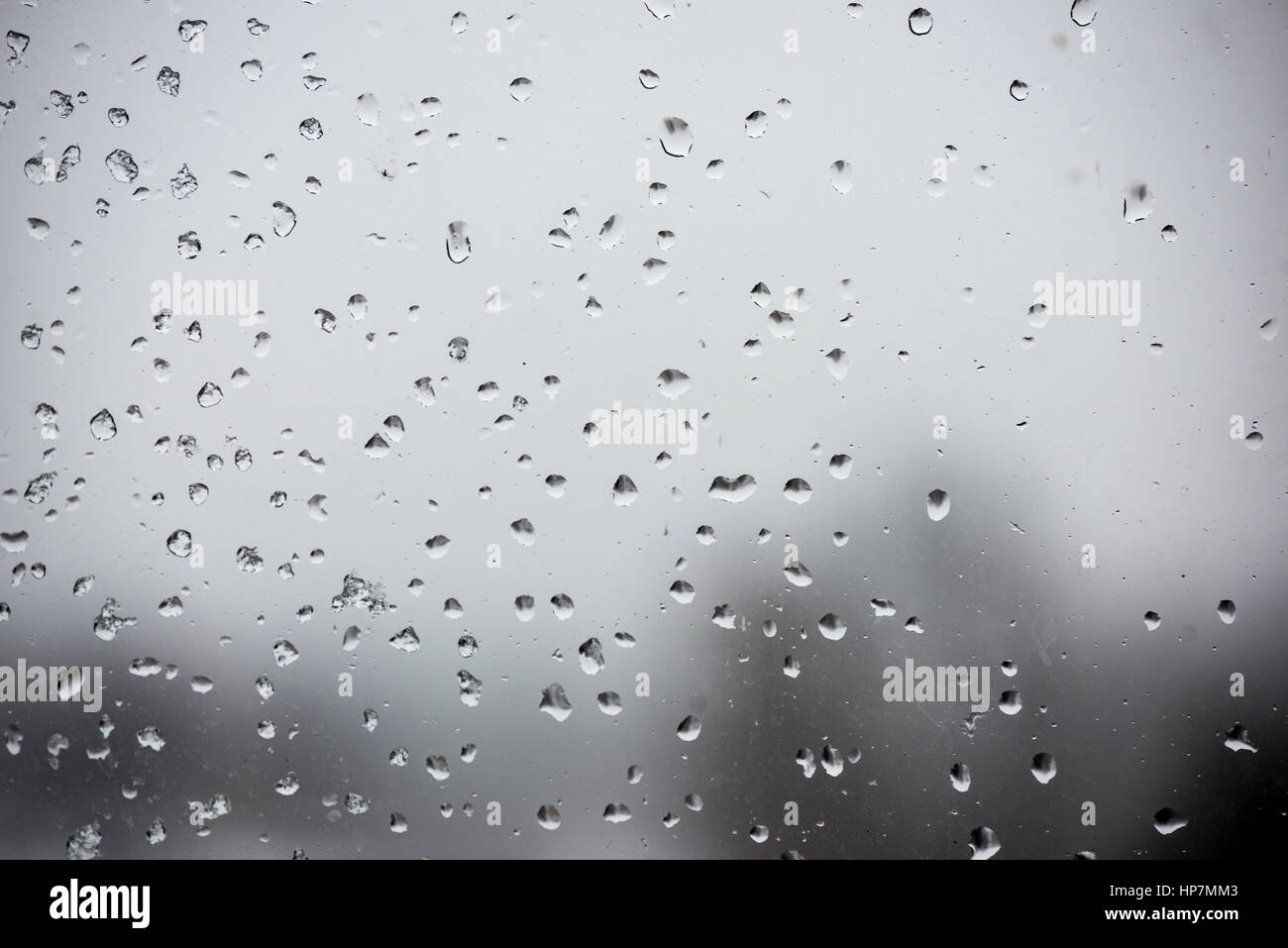 frozen raindrops on glass with blur background and gradient Stock Photo ...