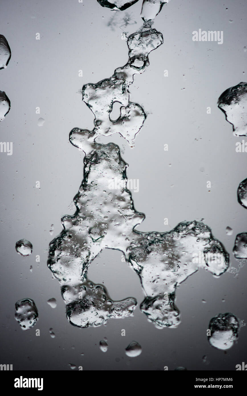 frozen raindrops on glass with blur background and gradient Stock Photo ...