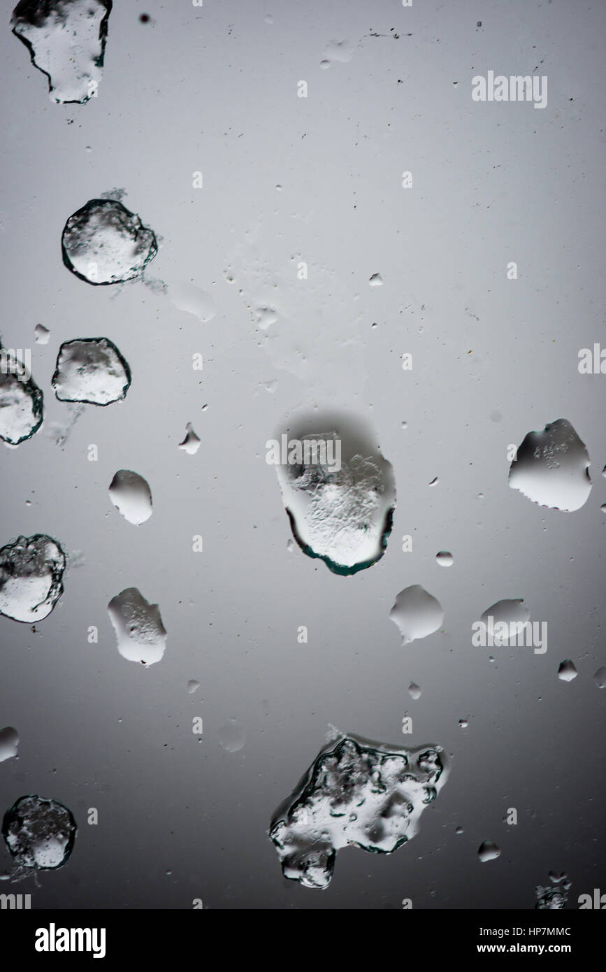 frozen raindrops on glass with blur background and gradient Stock Photo ...
