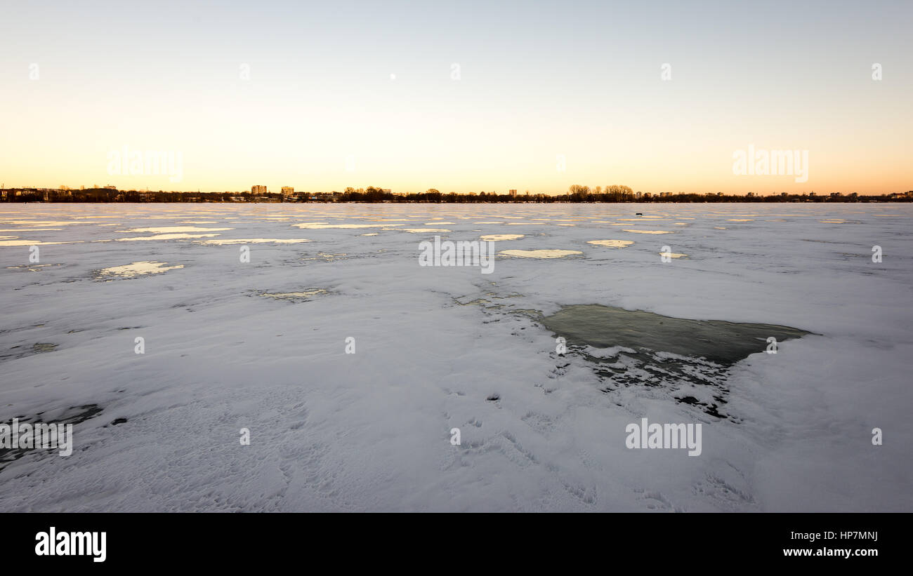 frozen beach in cold winters day with colorful sky and ice Stock Photo ...