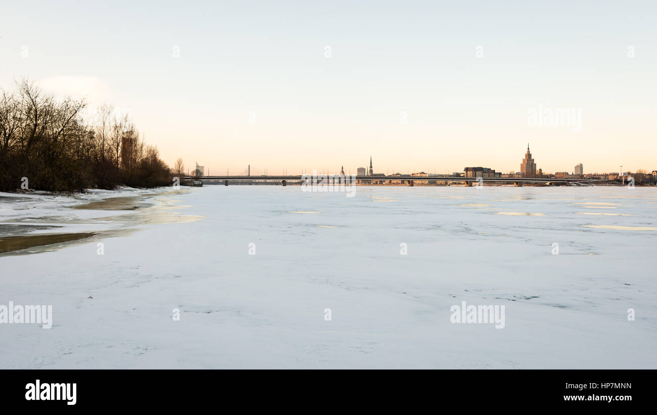 frozen beach in cold winters day with colorful sky and ice Stock Photo ...