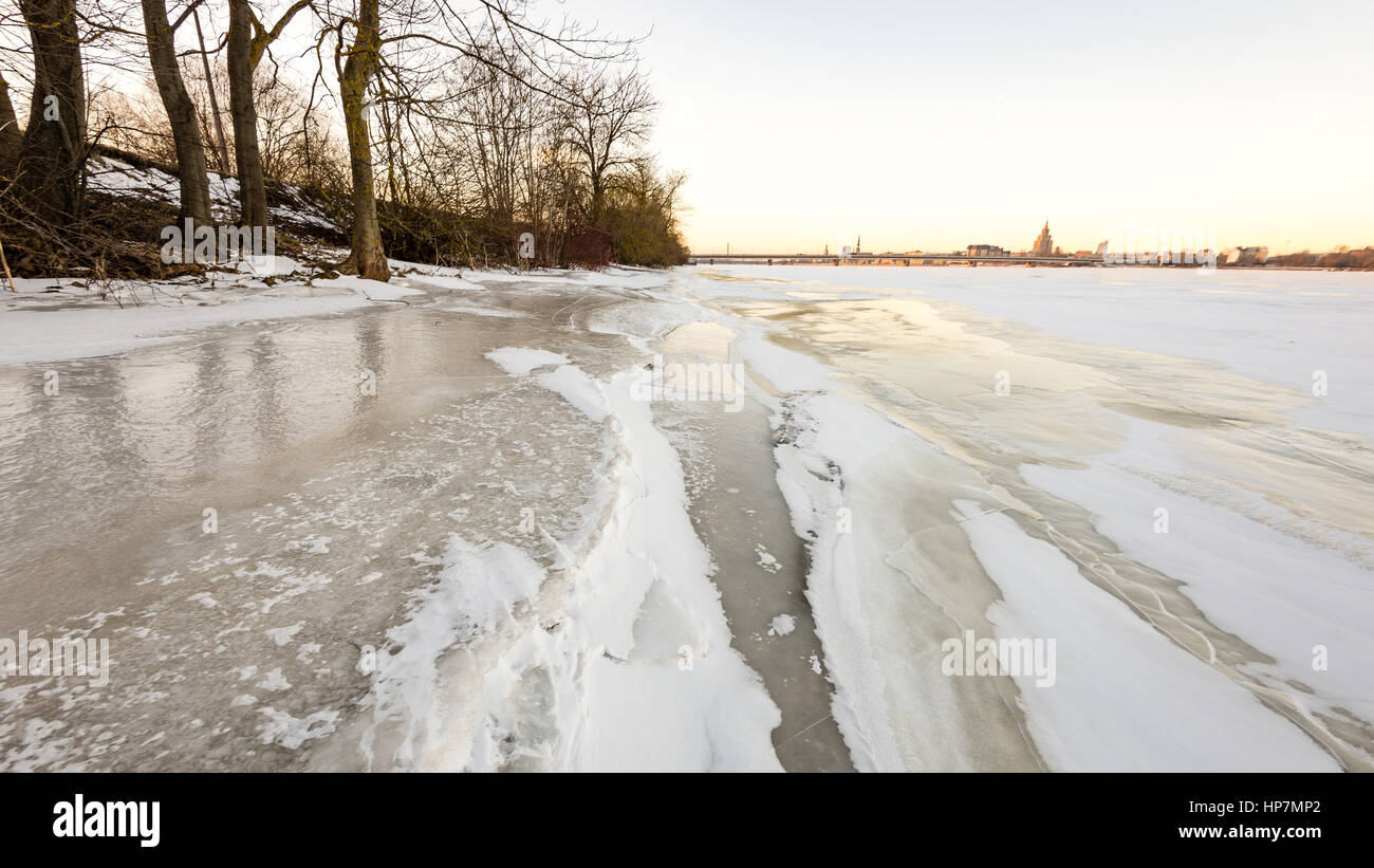 frozen beach in cold winters day with colorful sky and ice Stock Photo ...