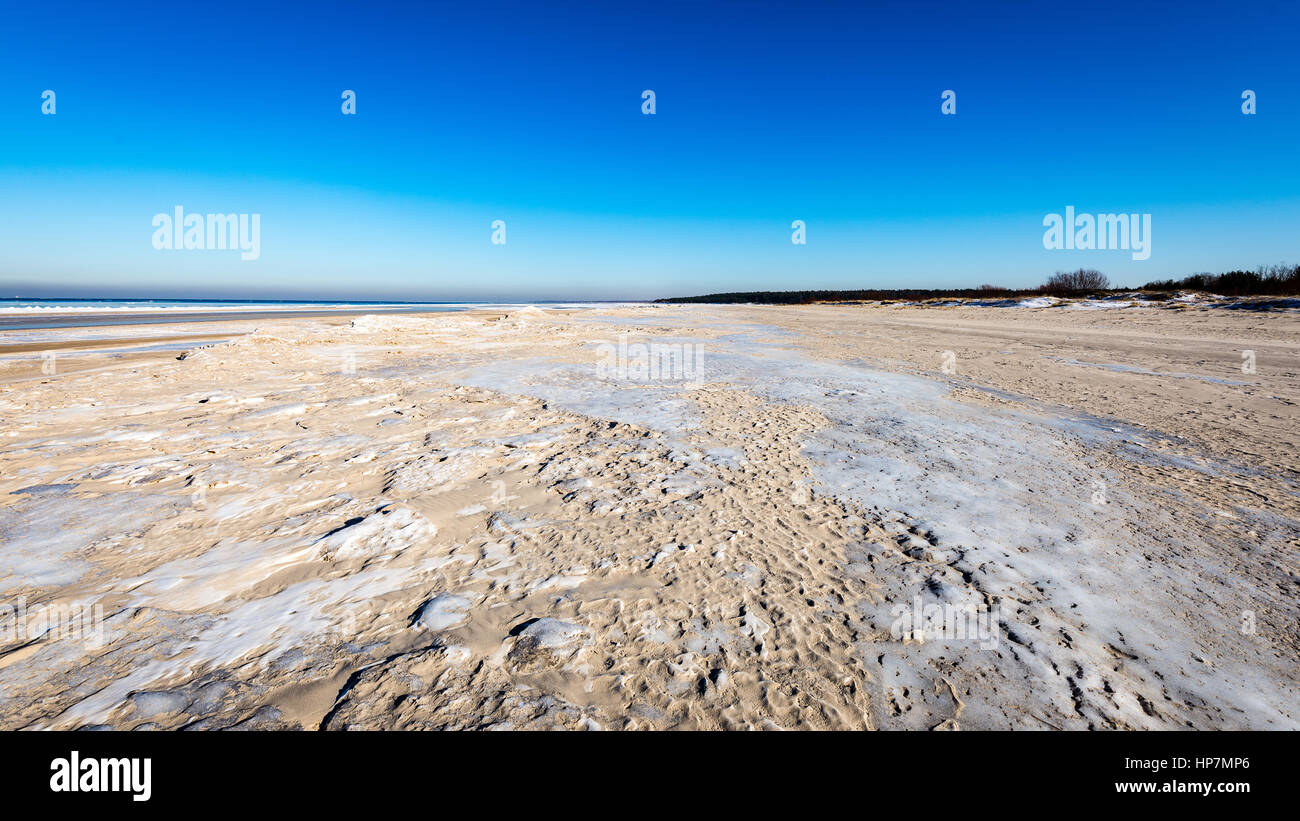 frozen beach in cold winters day with colorful sky and ice Stock Photo ...