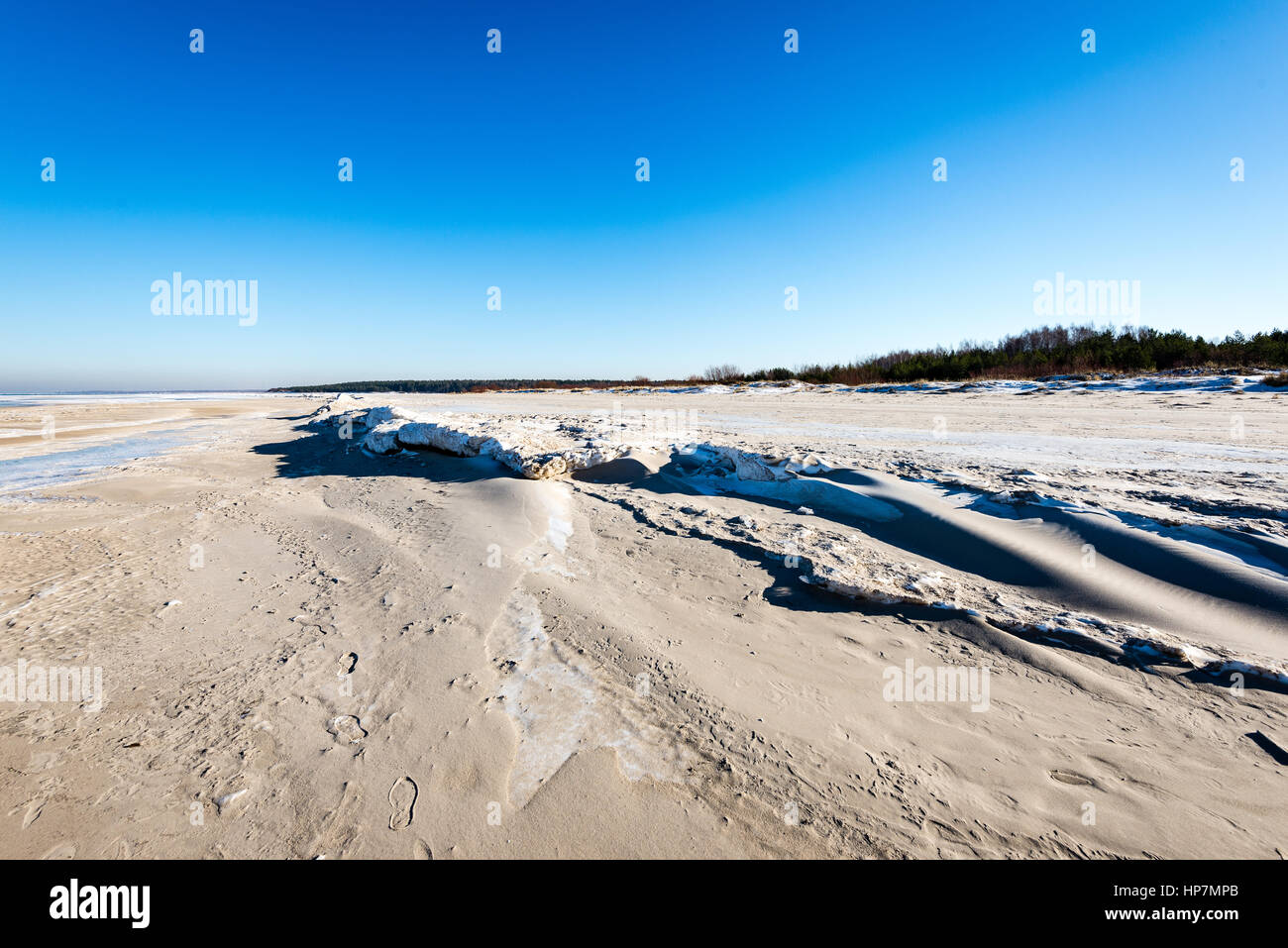 frozen beach in cold winters day with colorful sky and ice Stock Photo ...