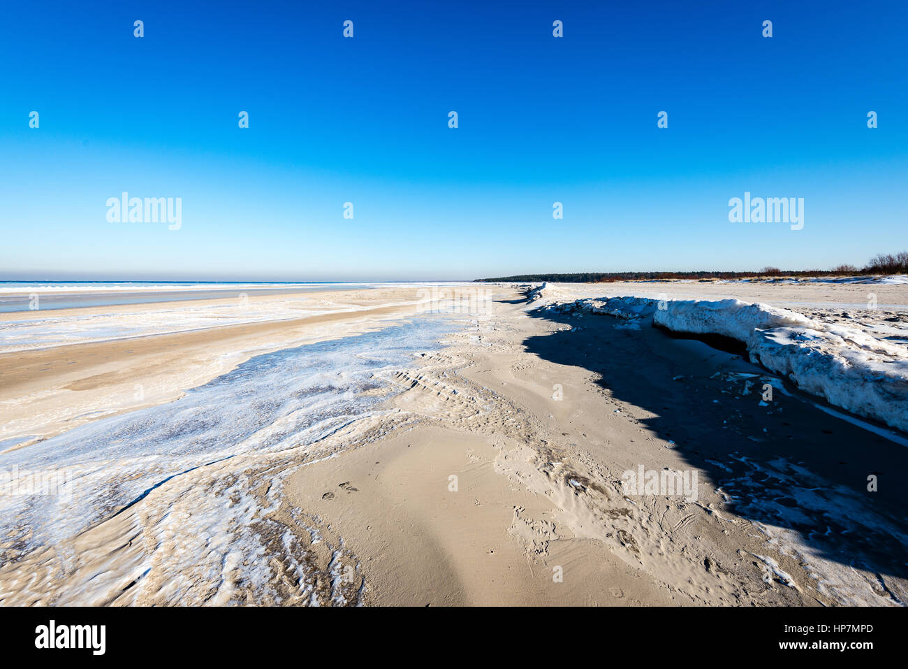 frozen beach in cold winters day with colorful sky and ice Stock Photo ...