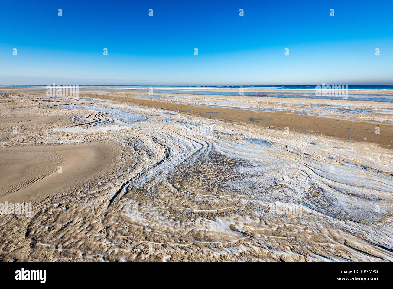frozen beach in cold winters day with colorful sky and ice Stock Photo ...