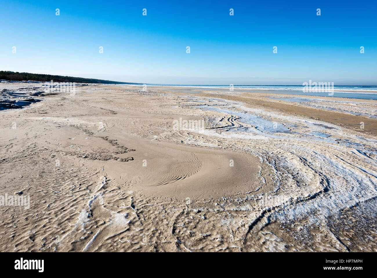 frozen beach in cold winters day with colorful sky and ice Stock Photo ...