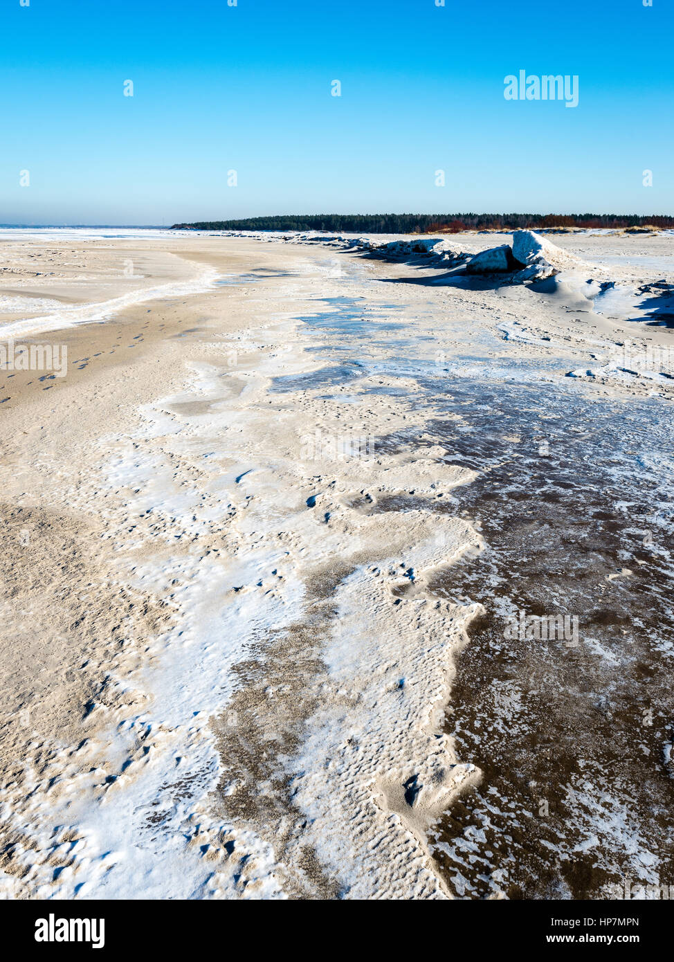 frozen beach in cold winters day with colorful sky and ice Stock Photo ...