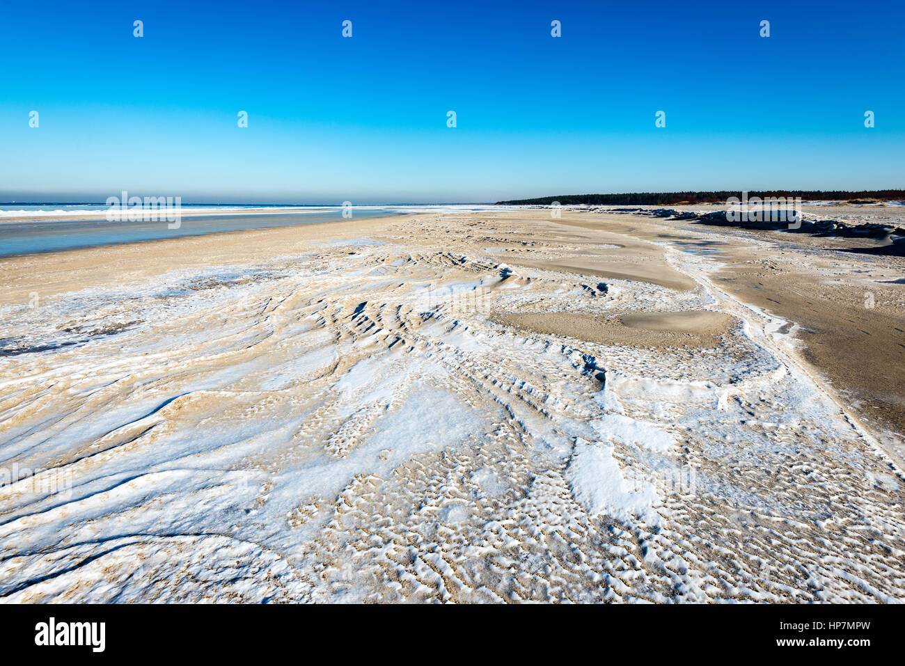 frozen beach in cold winters day with colorful sky and ice Stock Photo ...