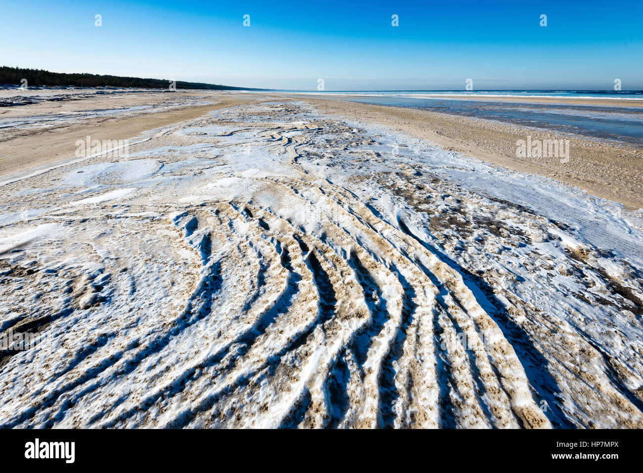 frozen beach in cold winters day with colorful sky and ice Stock Photo ...