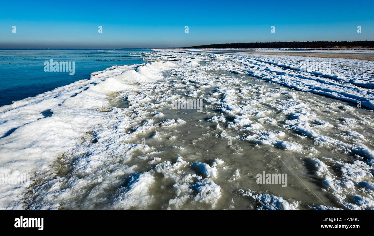 frozen beach in cold winters day with colorful sky and ice Stock Photo ...