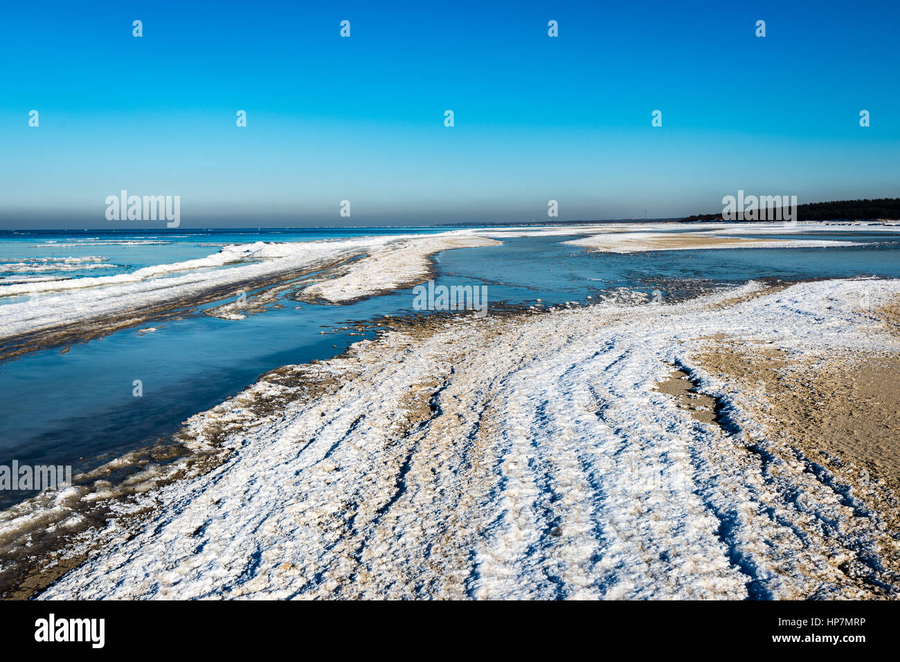 frozen beach in cold winters day with colorful sky and ice Stock Photo ...