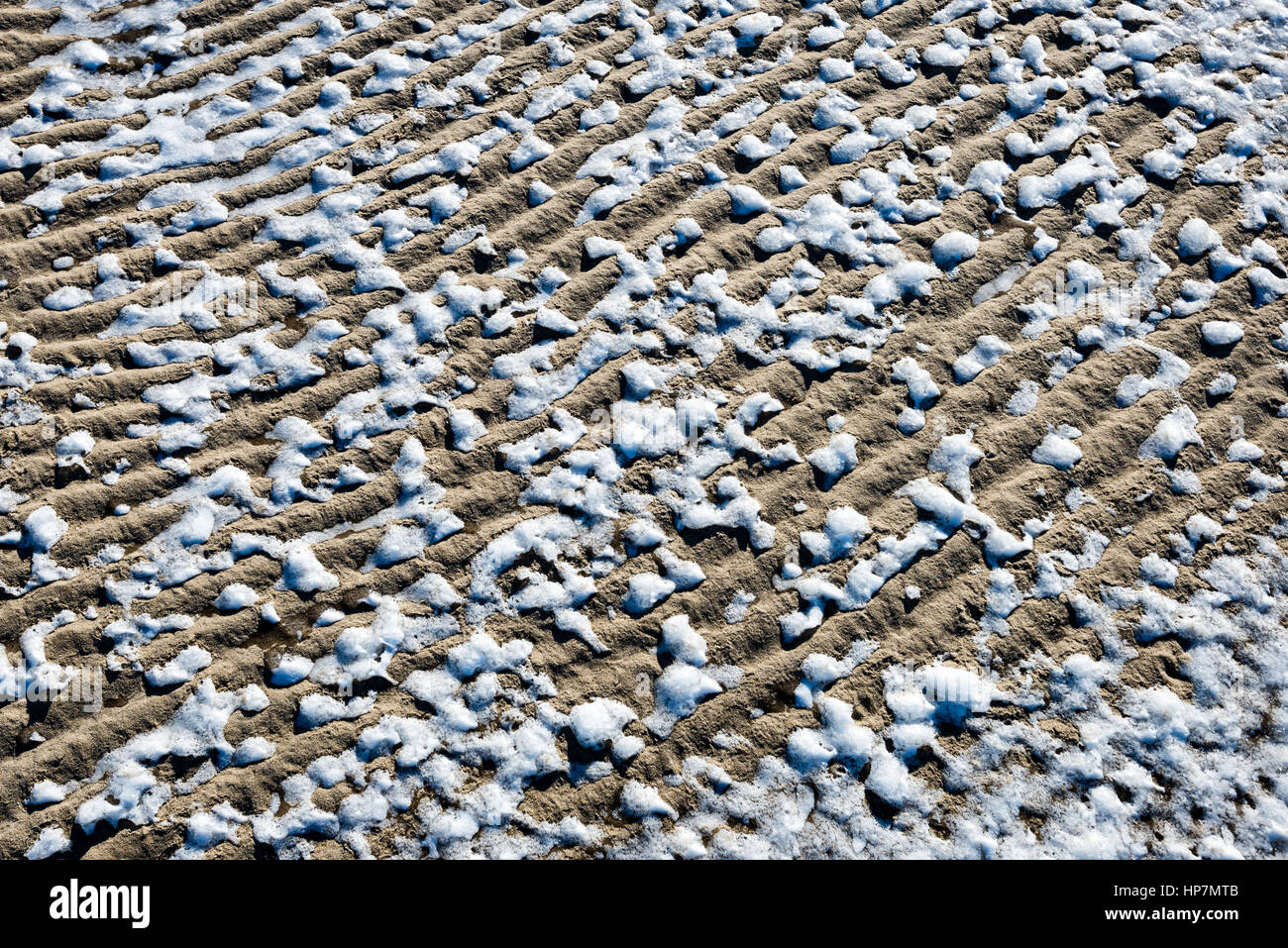 frozen sand with ice blocks. abstract texture in natural beach Stock ...
