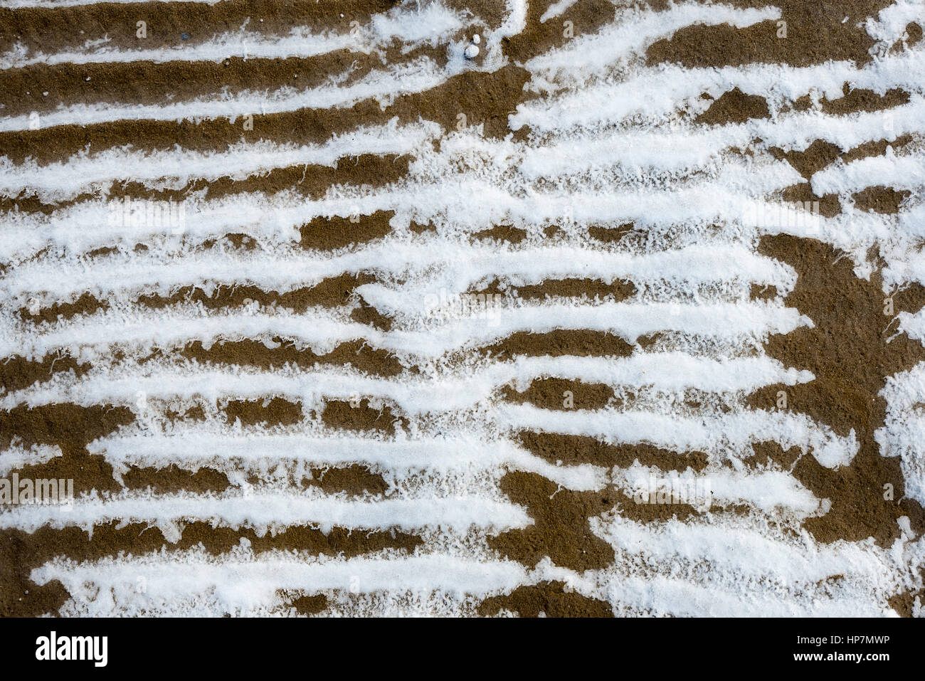 frozen sand with ice blocks. abstract texture in natural beach Stock ...
