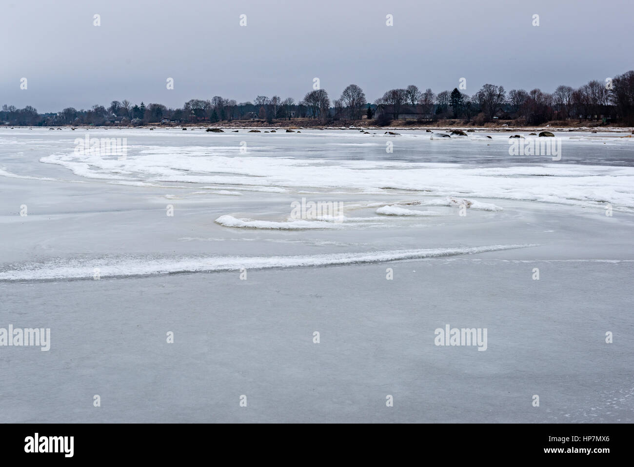 frozen beach in cold winters day with colorful sky and ice Stock Photo ...
