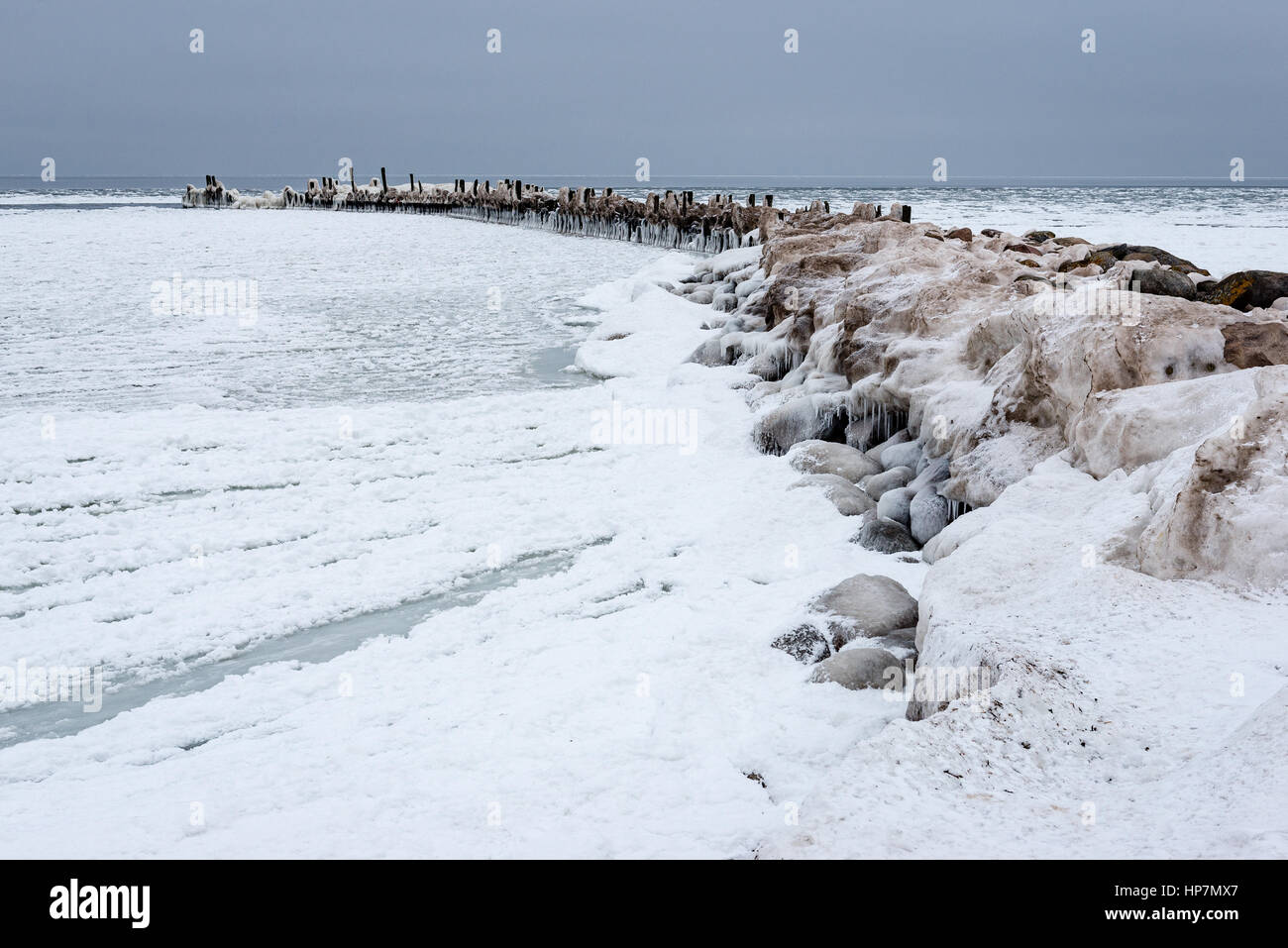 frozen beach in cold winters day with colorful sky and ice Stock Photo ...