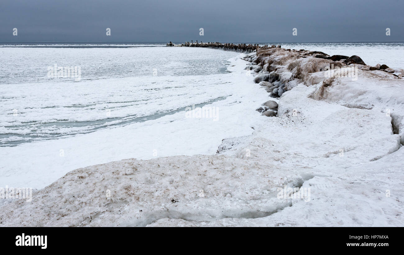 frozen beach in cold winters day with colorful sky and ice Stock Photo ...