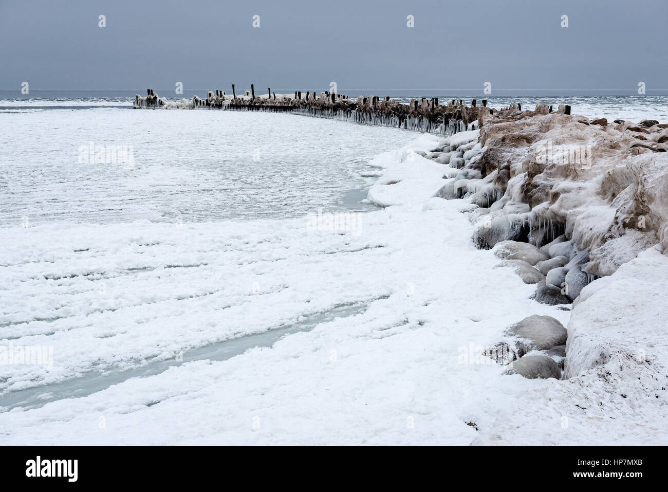 frozen beach in cold winters day with colorful sky and ice Stock Photo ...