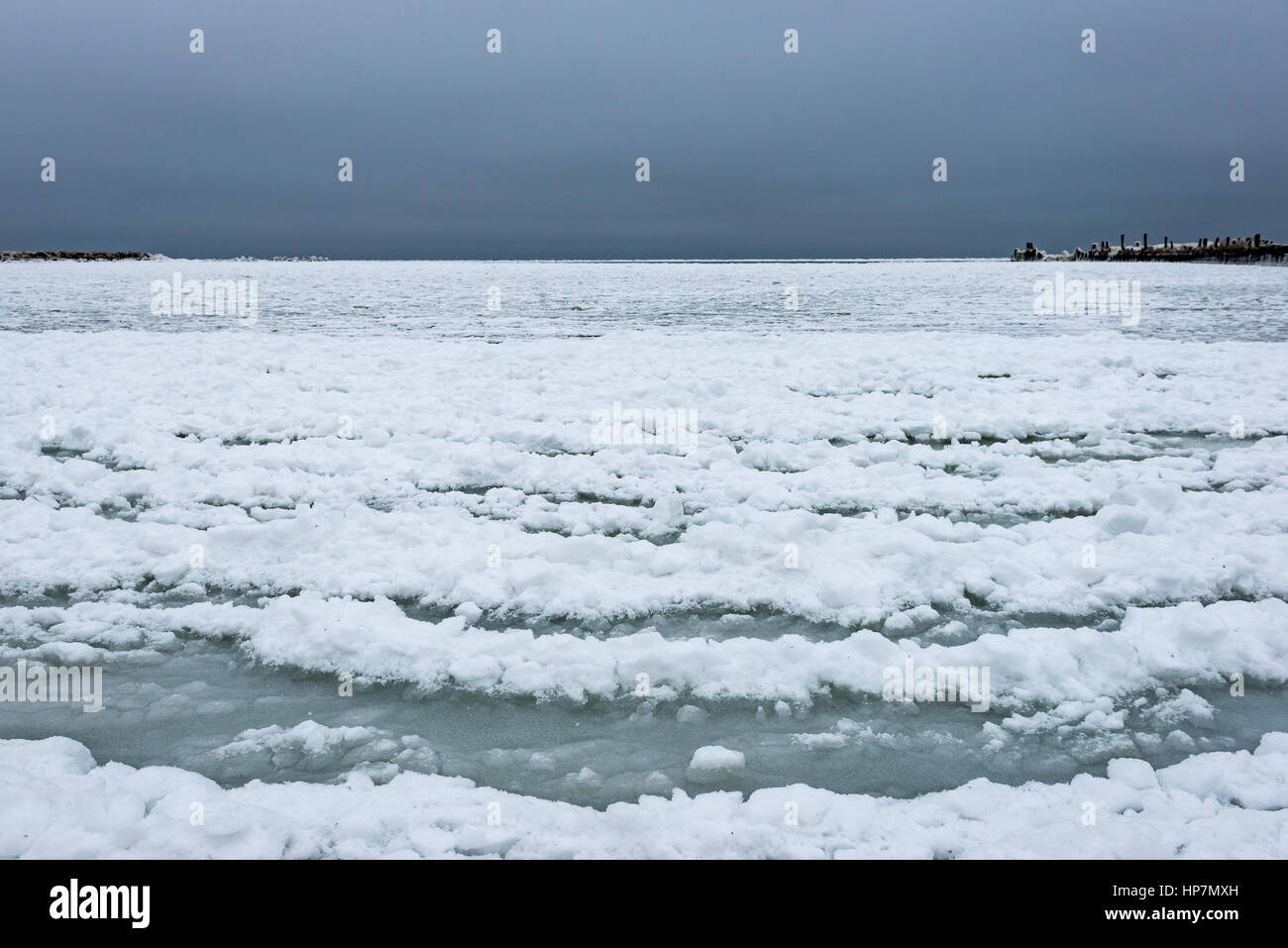frozen beach in cold winters day with colorful sky and ice Stock Photo ...