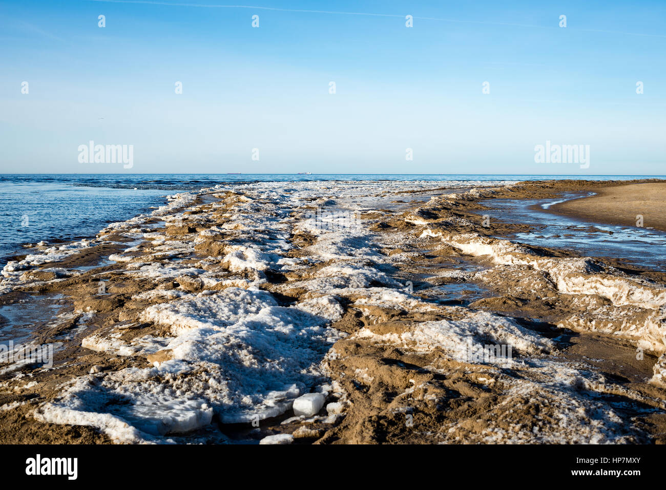 frozen beach in cold winters day with colorful sky and ice Stock Photo ...