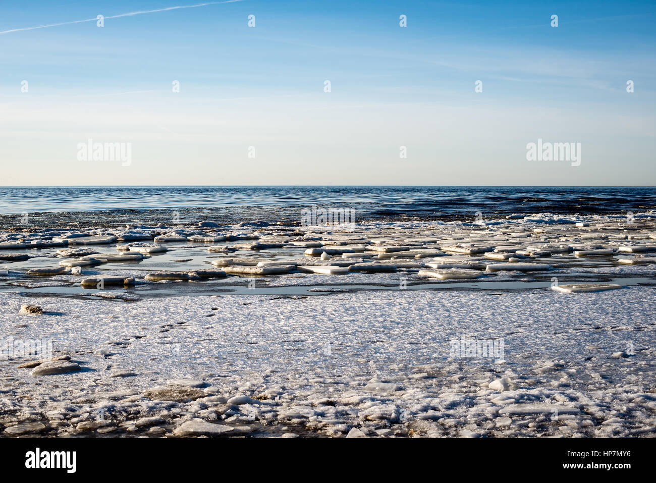 frozen beach in cold winters day with colorful sky and ice Stock Photo ...