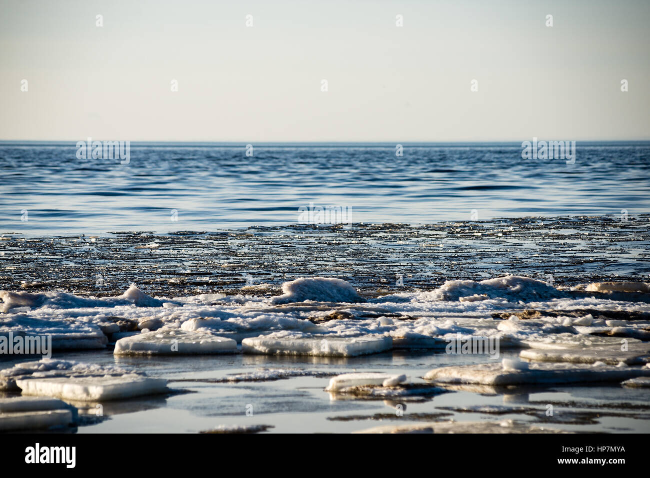 frozen beach in cold winters day with colorful sky and ice Stock Photo ...
