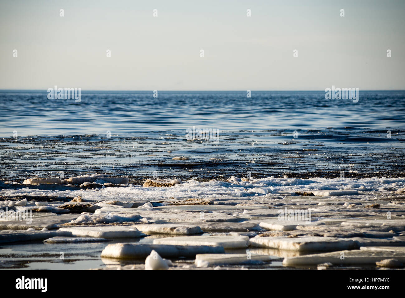 frozen beach in cold winters day with colorful sky and ice Stock Photo ...
