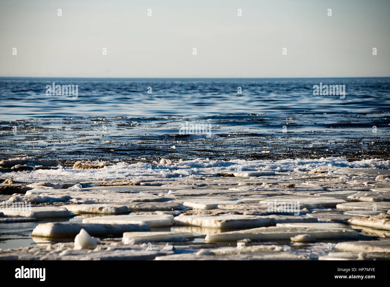 frozen beach in cold winters day with colorful sky and ice Stock Photo ...