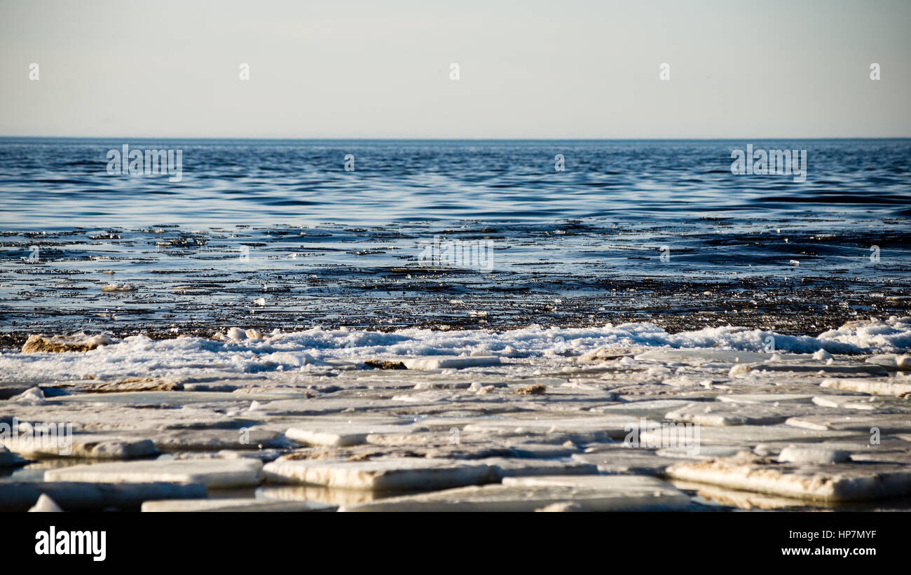 frozen beach in cold winters day with colorful sky and ice Stock Photo ...