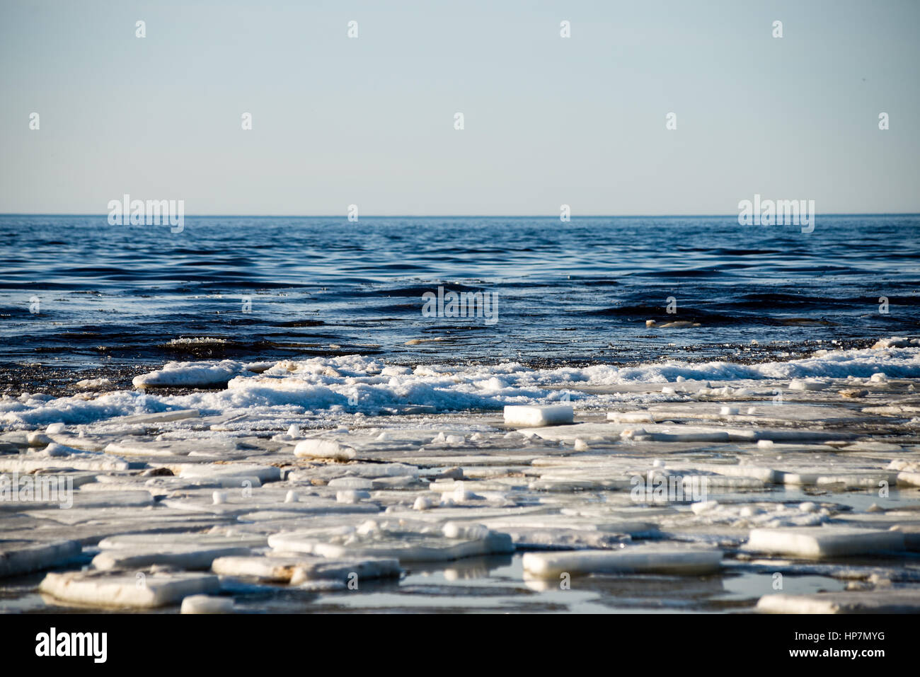 frozen beach in cold winters day with colorful sky and ice Stock Photo ...