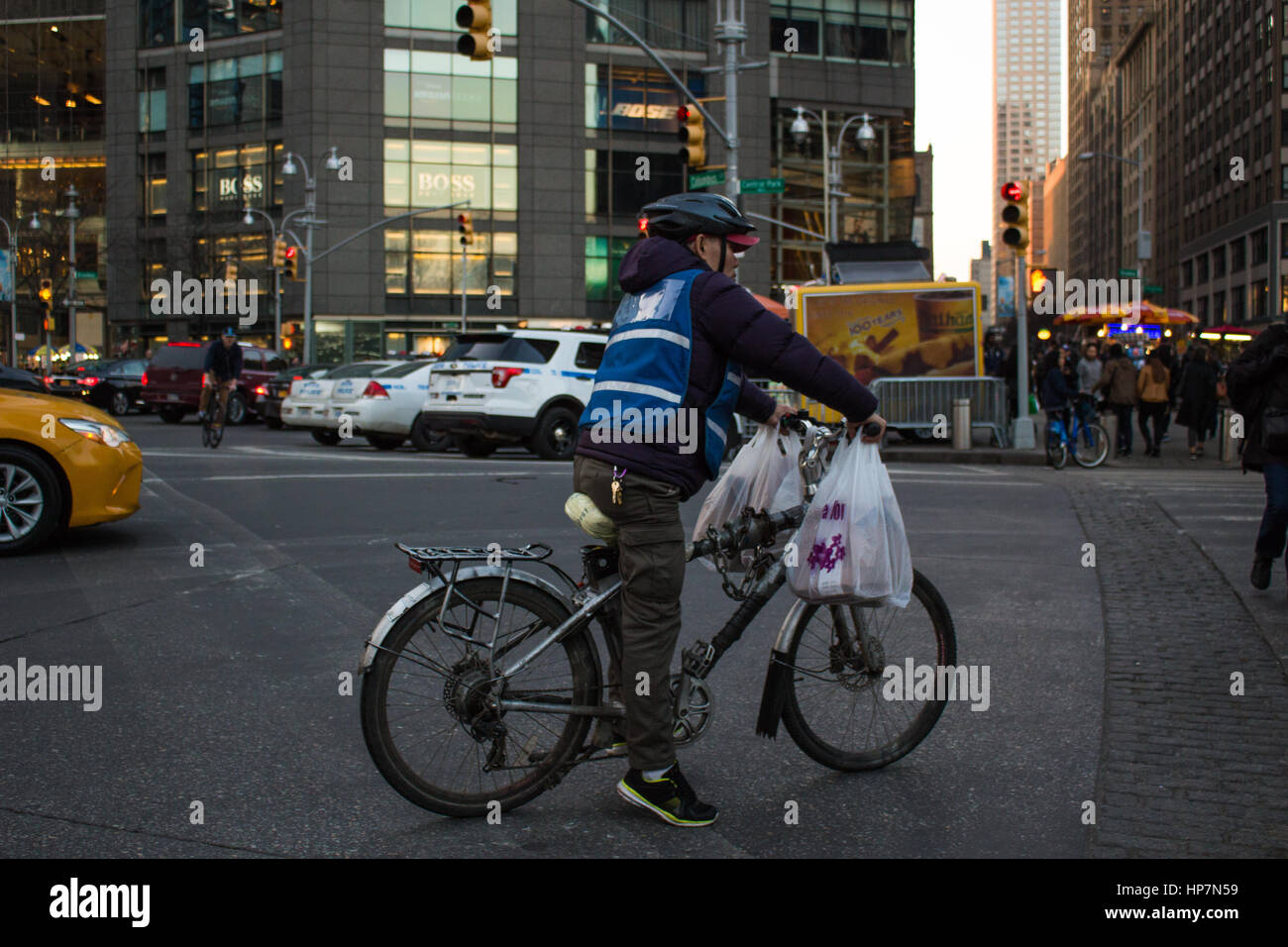 Mature man riding bike in new york city Stock Photo - Alamy