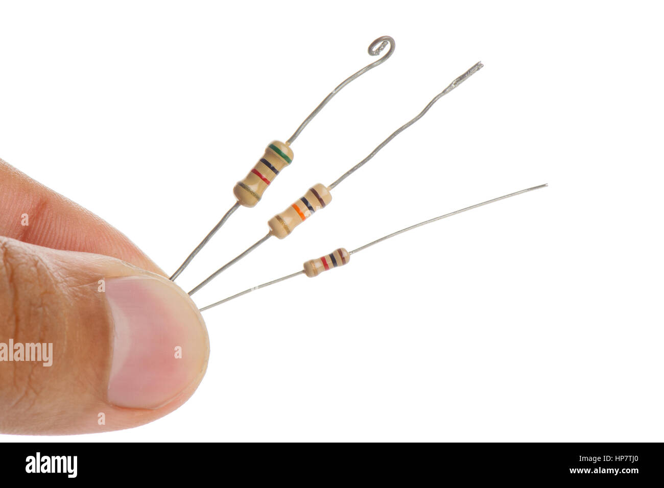 technician holding three different value of resistors Stock Photo - Alamy