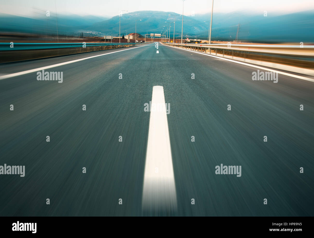 Empty highway road with perspective and mountains Stock Photo - Alamy