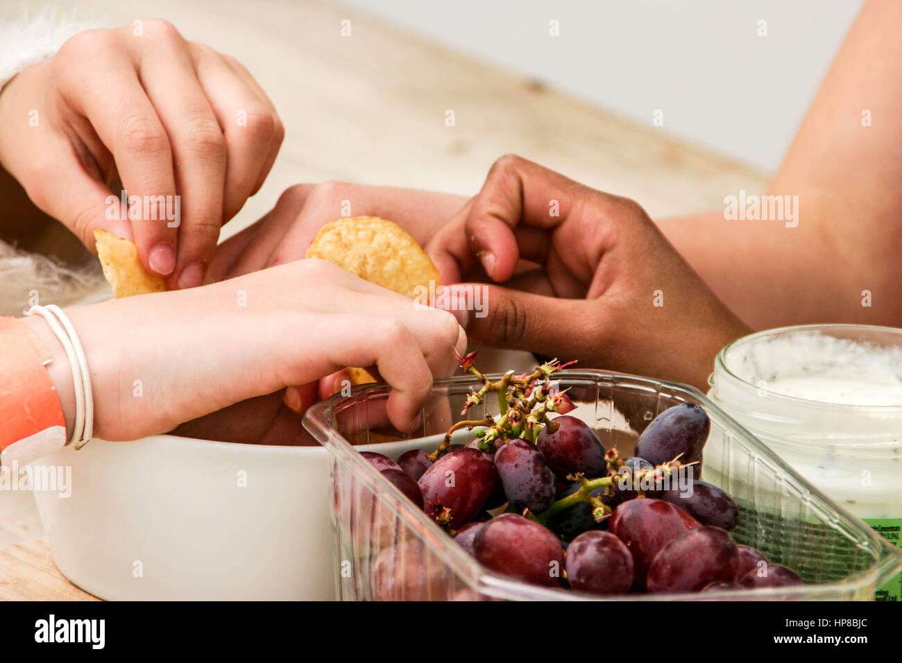 Children eating crisps, snacks at a party Stock Photo - Alamy