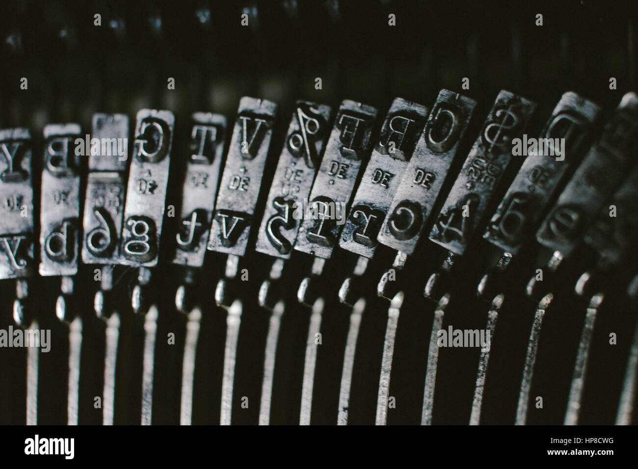 A set of several typewriter keys close up in black and white with film ...