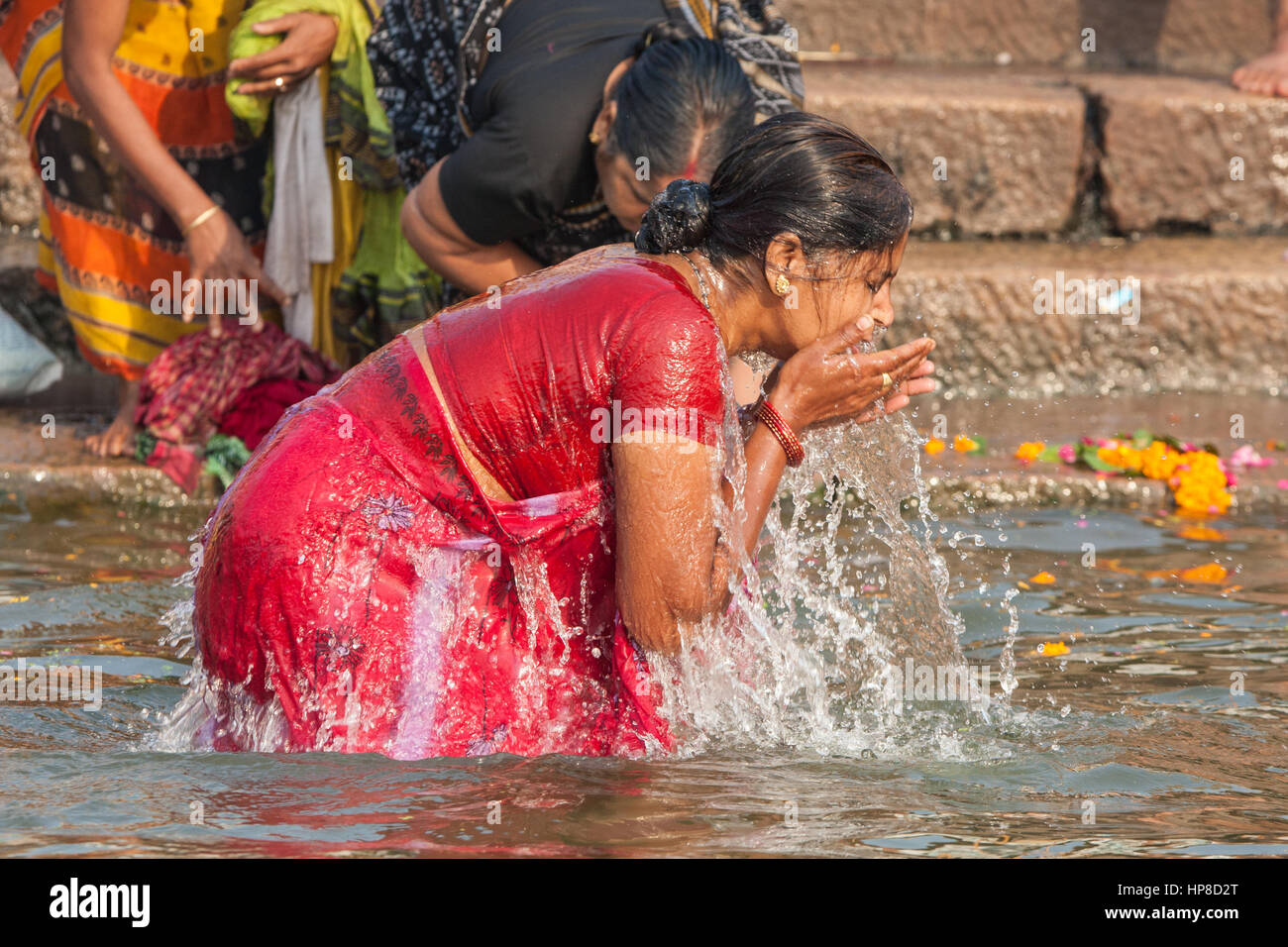 Hindu woman bathing hi-res stock photography and images - Alamy
